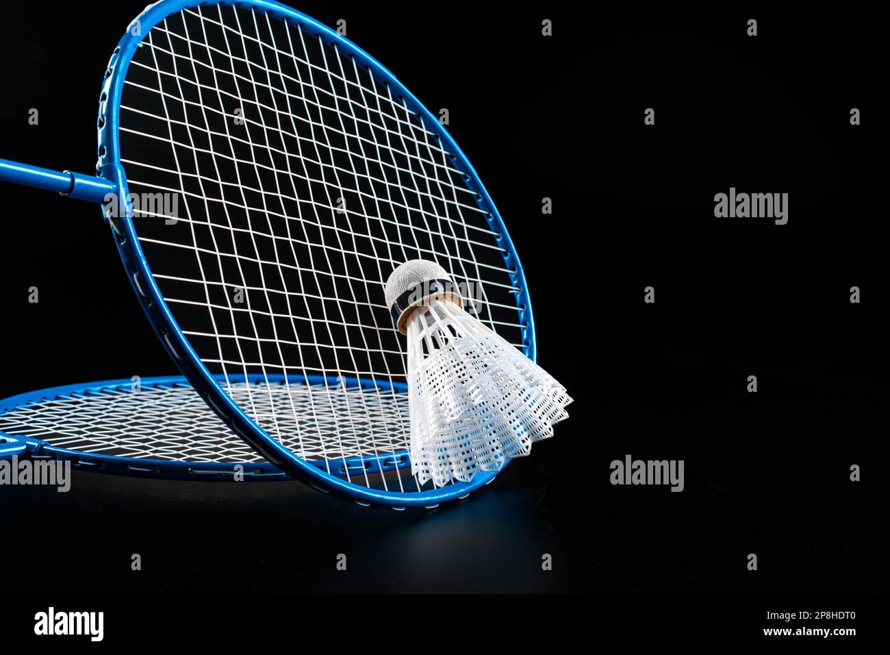 Badminton sport equipment on dark black background Stock Photo - Alamy