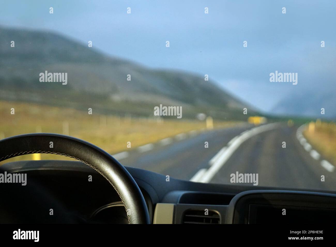 Driving a car - perspective of a driver - bokeh effect Stock Photo - Alamy