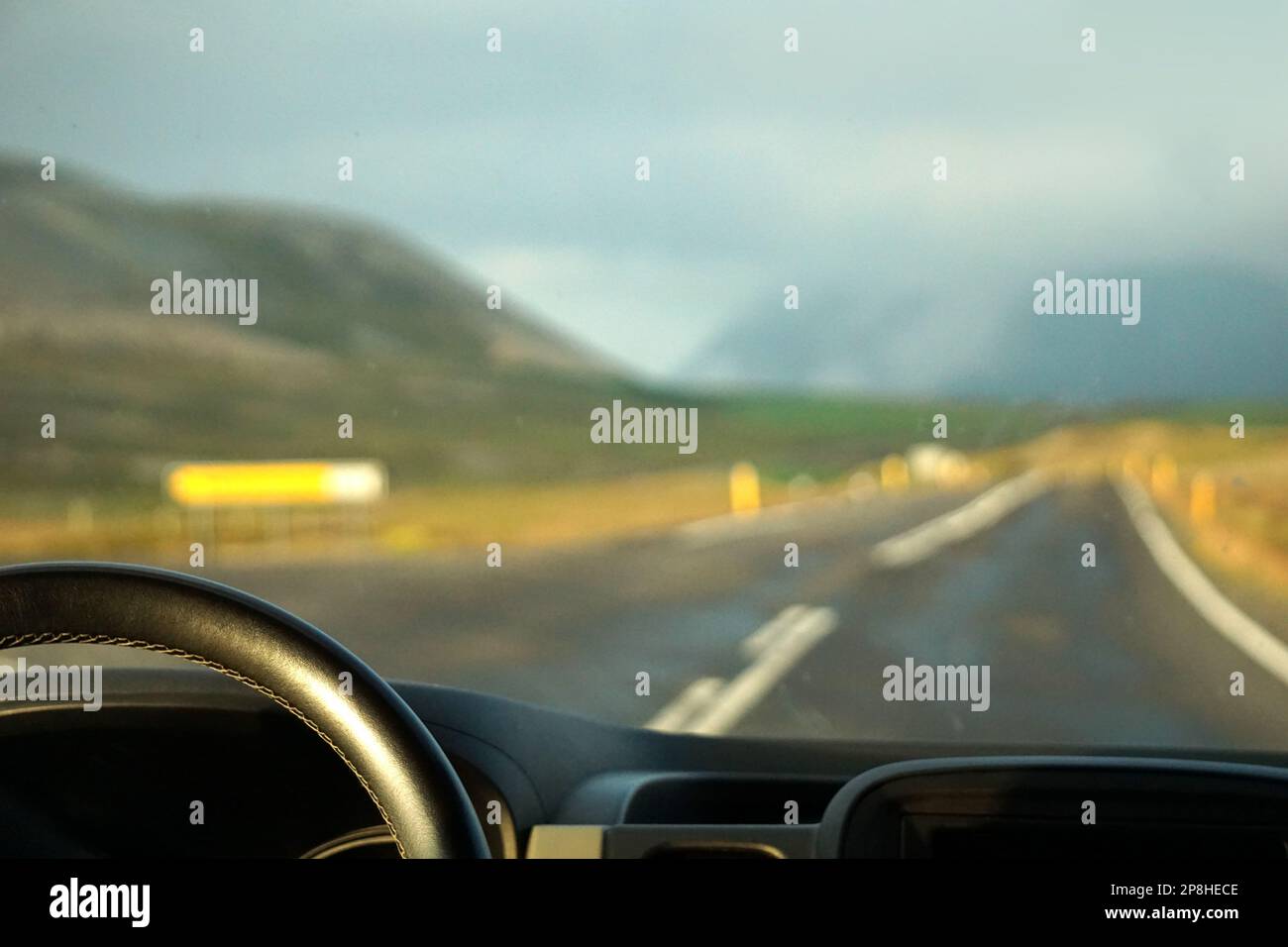 Driving a car - perspective of a driver - bokeh effect Stock Photo - Alamy