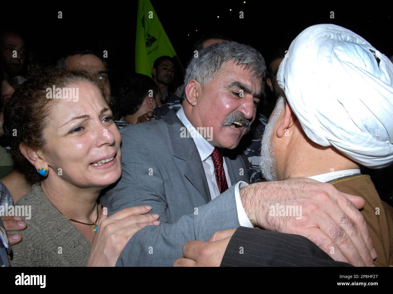 A sheik, right, congratulates Maj. Gen. Ali Hajj, center, after his ...