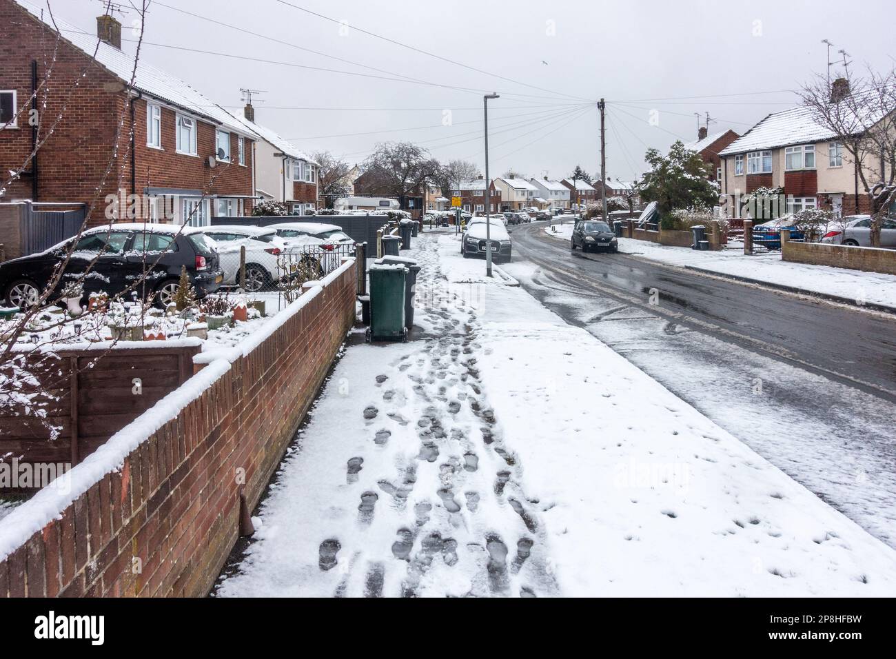 View down a street in Reading, UK which is covered by a fall of snow ...