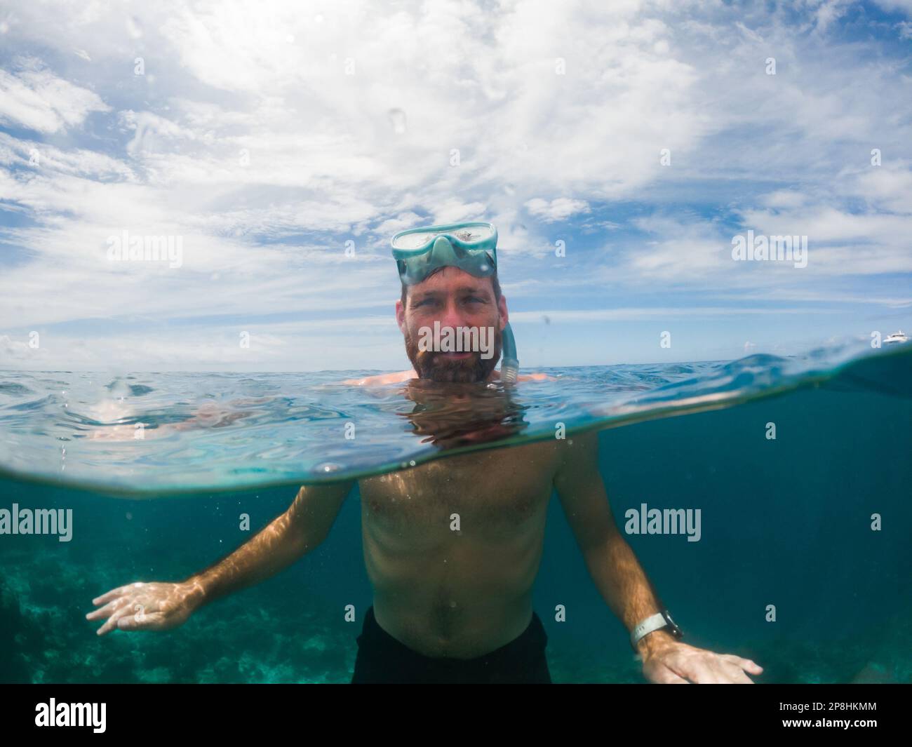 man snorkeling in crystal clear tropical sea Stock Photo - Alamy