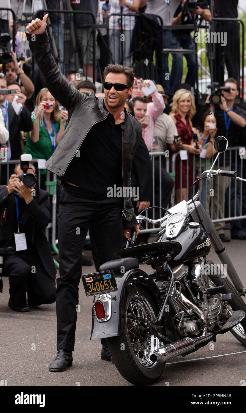 Actor Hugh Jackman waves to the crowd as he arrives for the world ...