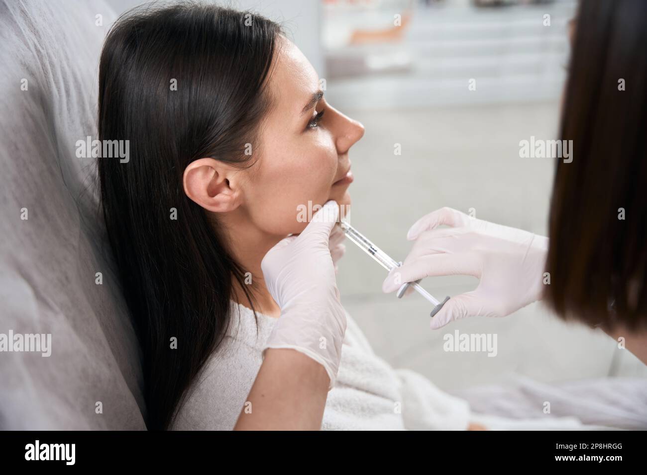 Lady on injection procedure for facial skin nutrition Stock Photo - Alamy