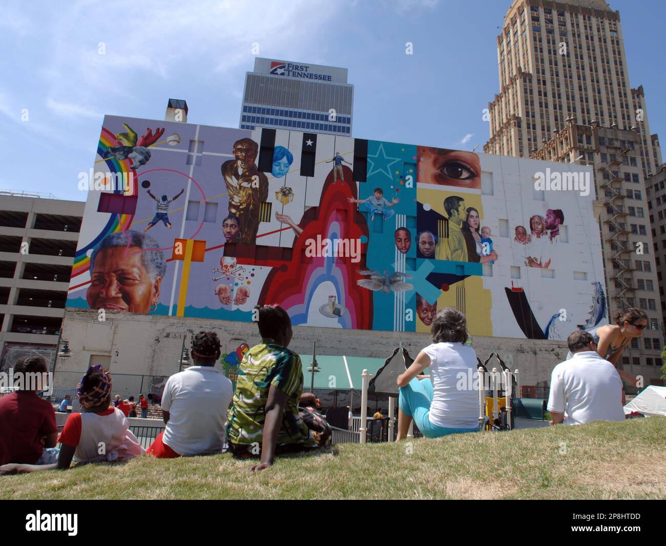 Visitors to AutoZone Park in Memphis, Tenn. look at the new mural being ...