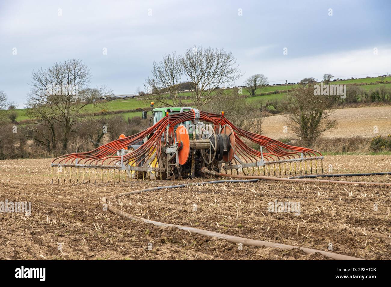 Spreading digestate from anaerobic digester near Timoleague Stock Photo ...