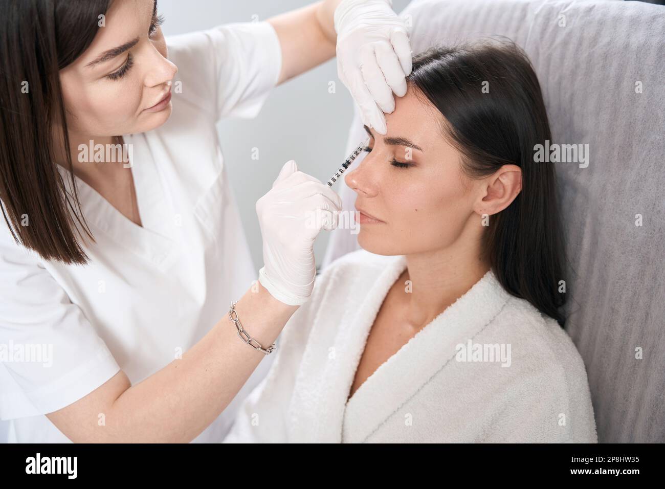 Pretty lady on injection procedure for facial skin nutrition Stock ...