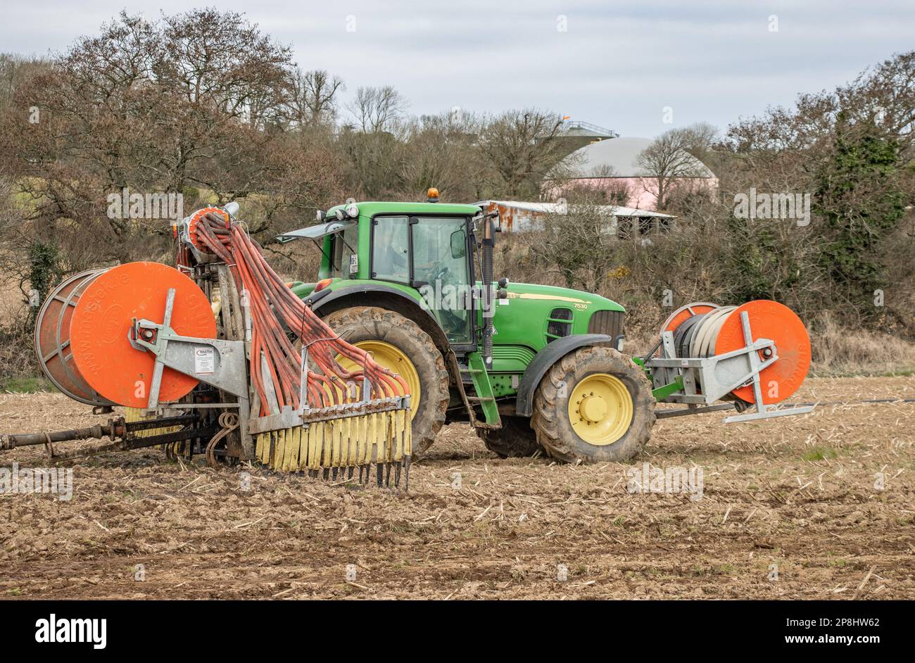 Spreading digestate from anaerobic digester near Timoleague Stock Photo ...