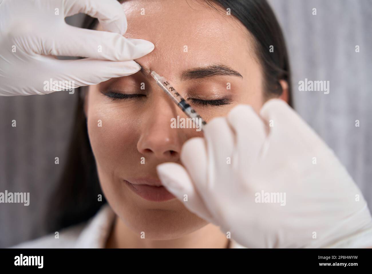 Beautiful lady on injection procedure for facial skin nutrition Stock ...