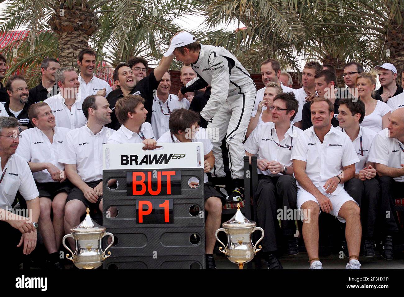Brawn GP driver Jenson Button of Britain celebrates with his team in ...