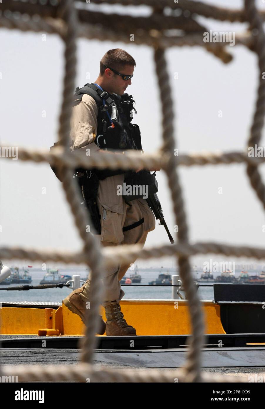 A soldier of the Standing NATO Maritime Group One stands guard abroad ...