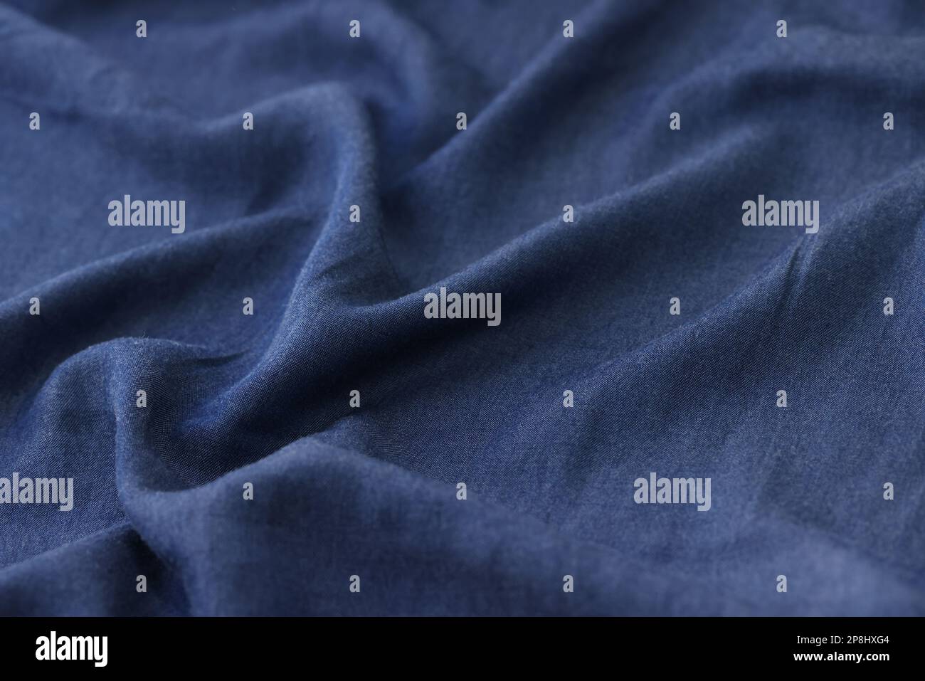 Wavy blue textile as background. Blue unicolor fabric close up Stock ...