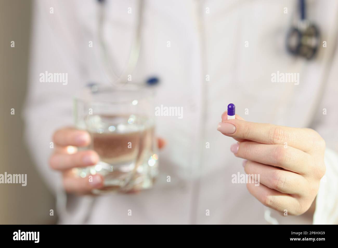 Woman shows pill hi-res stock photography and images - Alamy