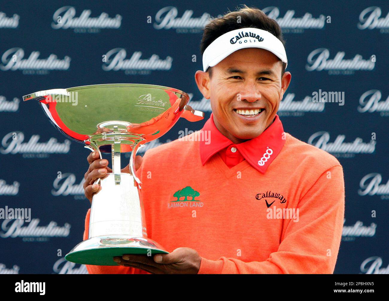 Thailand's Thongchai Jaidee pose after he won the EPGA Ballantine's ...