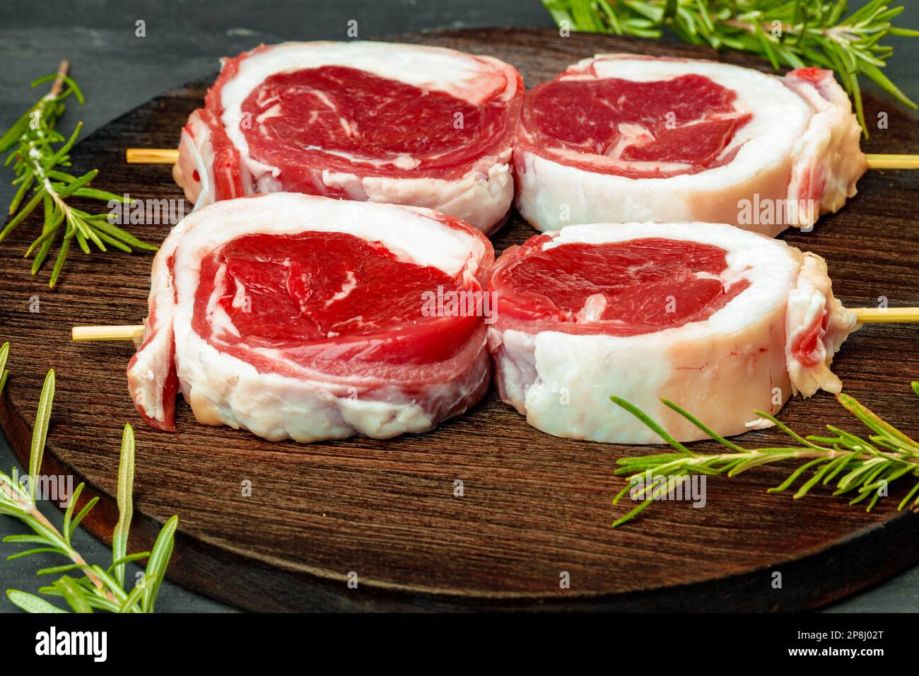 fresh meat with ingredients for cooking on dark background Stock Photo ...