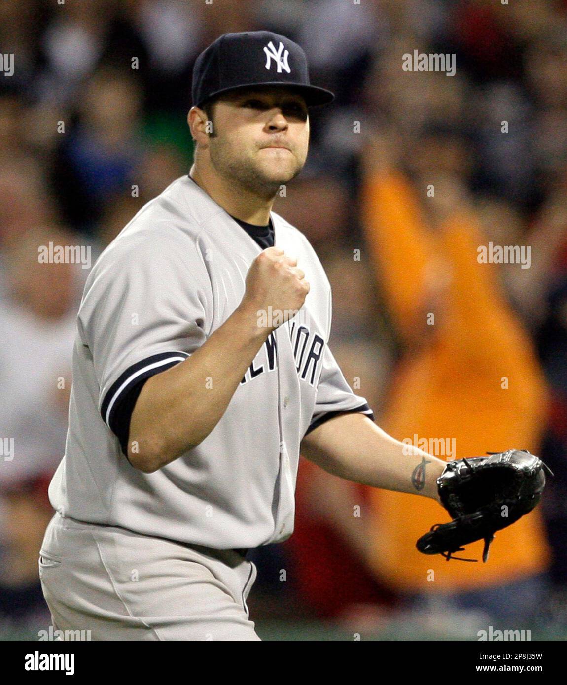 New York Yankees starting pitcher Joba Chamberlain reacts after the ...