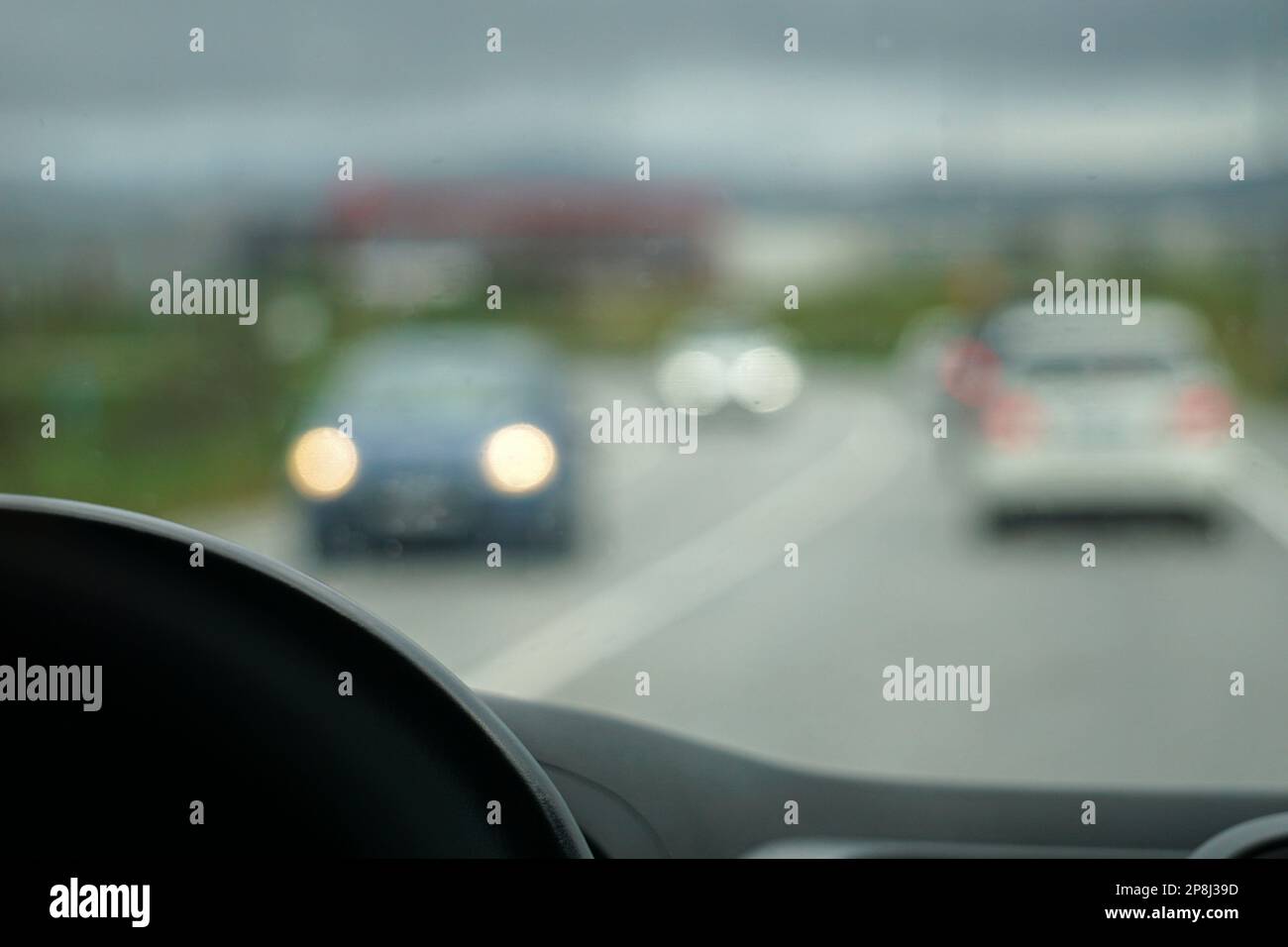 Driving a car - perspective of a driver Stock Photo - Alamy
