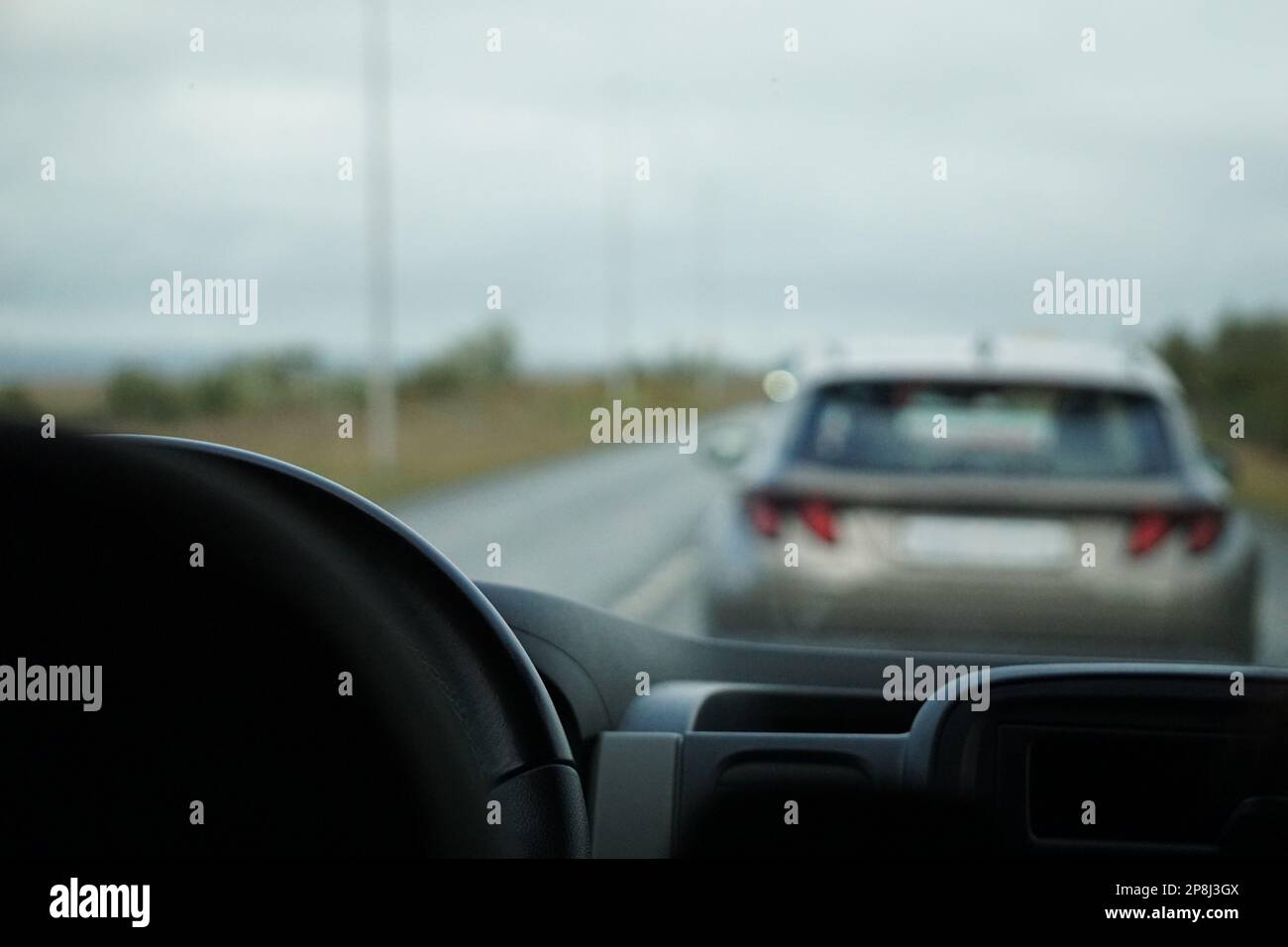 Driving a car - perspective of a driver - bokeh effect Stock Photo - Alamy
