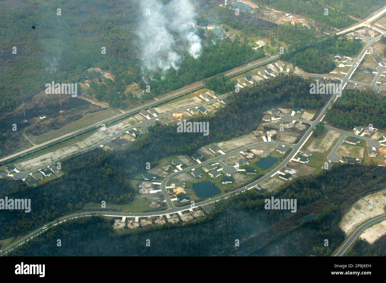 This aerial photo shows the destruction to homes on Thursday, April 23 ...