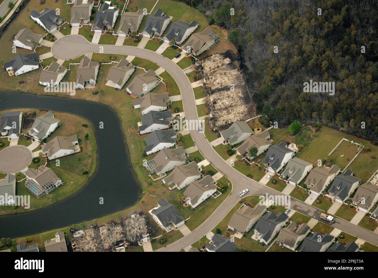 This aerial photo shows the destruction to homes on Thursday, April 23 ...