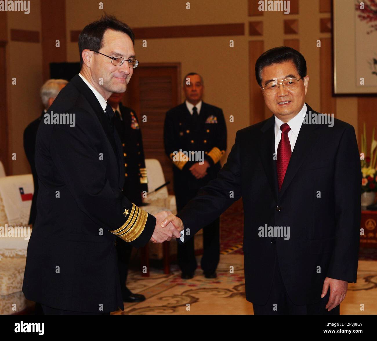 Chinese President Hu Jintao, right, meets Vice Admiral John Bird ...