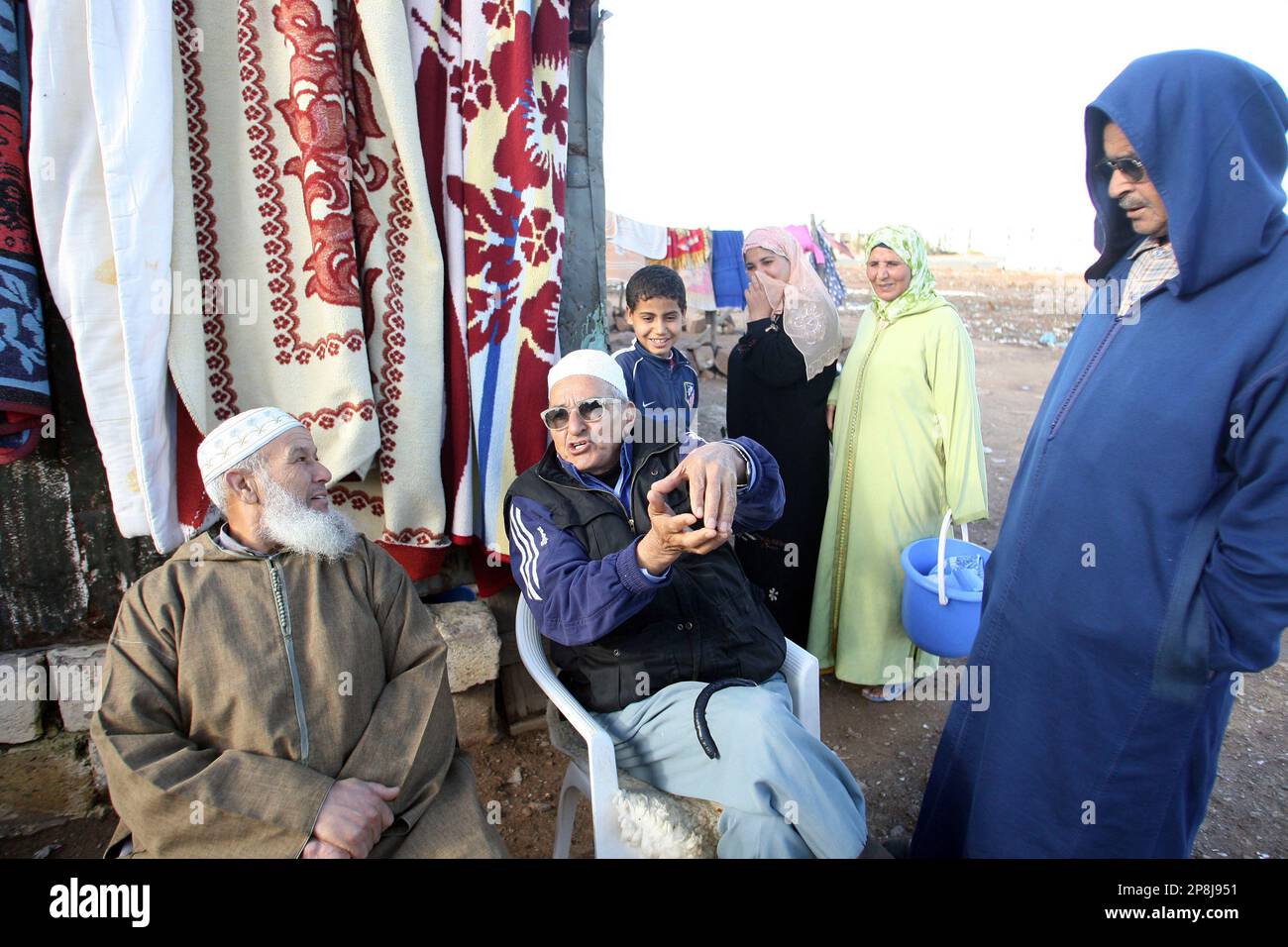 FILE - In this photo taken on Friday, March 6, 2009, residents talk in ...