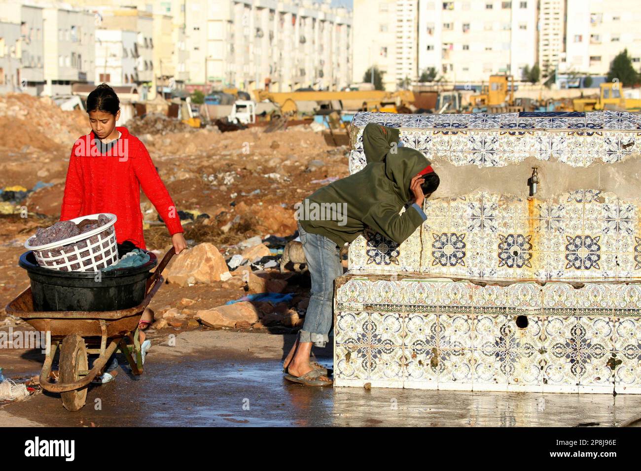 FILE - In this photo taken on Friday, March 6, 2009, a child drinks at ...