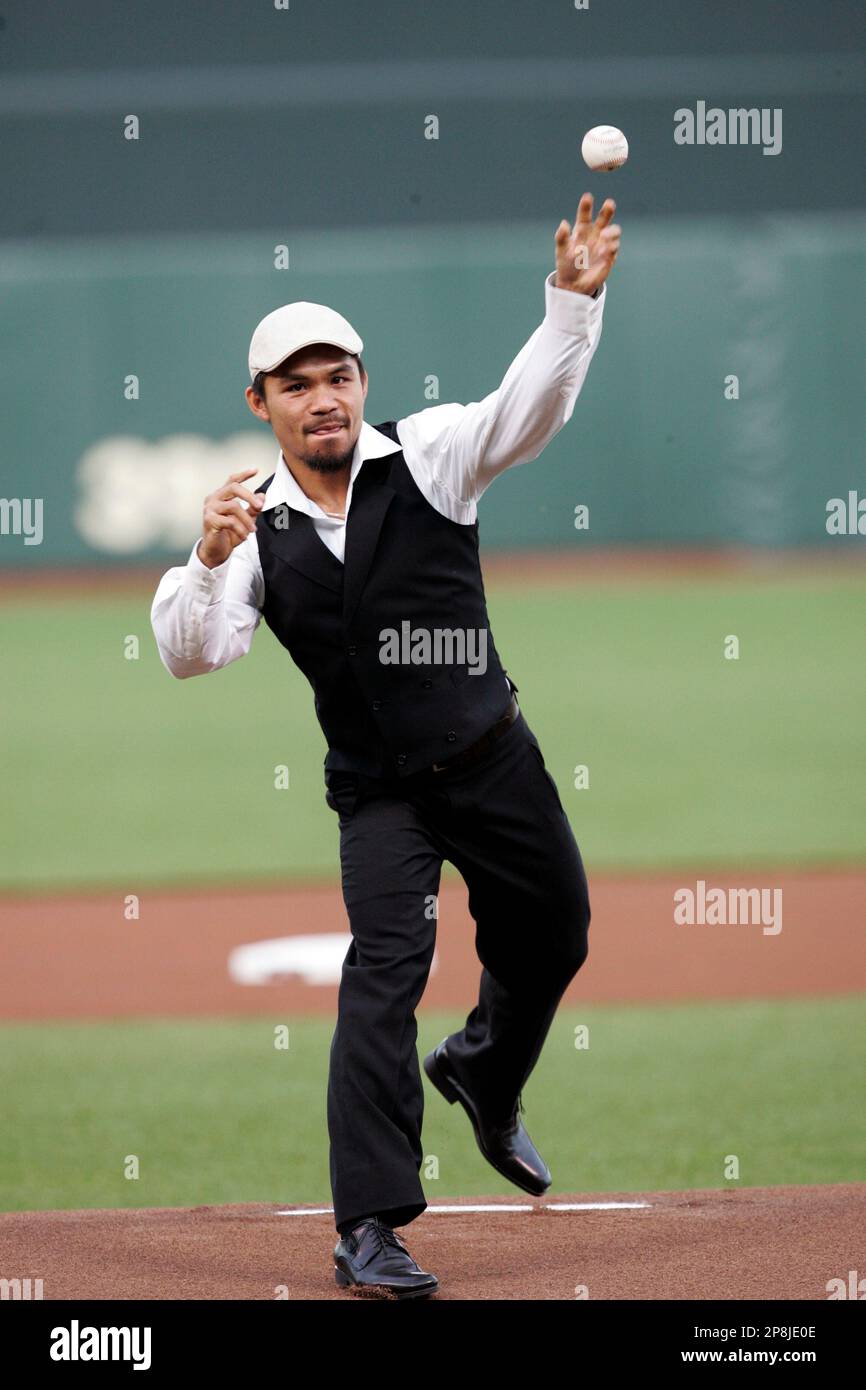 Boxer Manny Pacquiao, of the Philippines, throws the ceremonial first ...