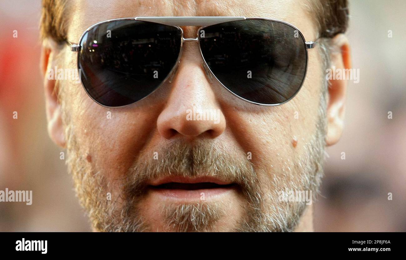 Australian actor Russell Crowe poses for photographers as he arrives at ...