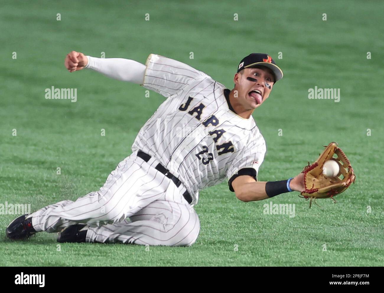 U.S. Lars Taylor-Tatsuji Nootbaar of Japan national team catches a ball ...