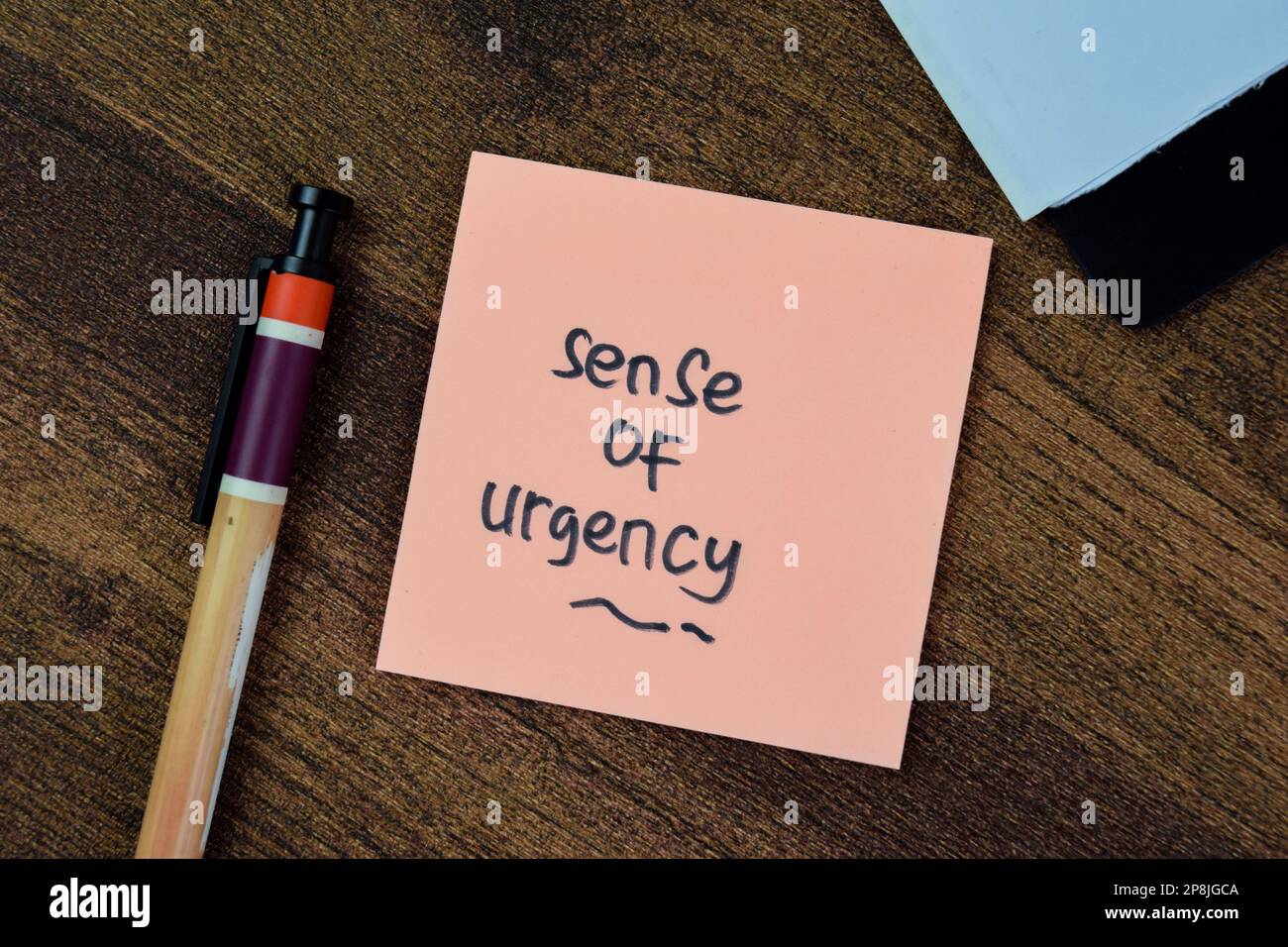 Concept of Sense of Urgency write on sticky notes isolated on Wooden ...