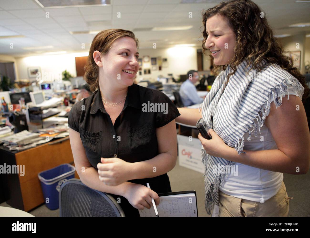 The Las Vegas Sun reporter Alexandra Berzon, left, is congratulated by ...