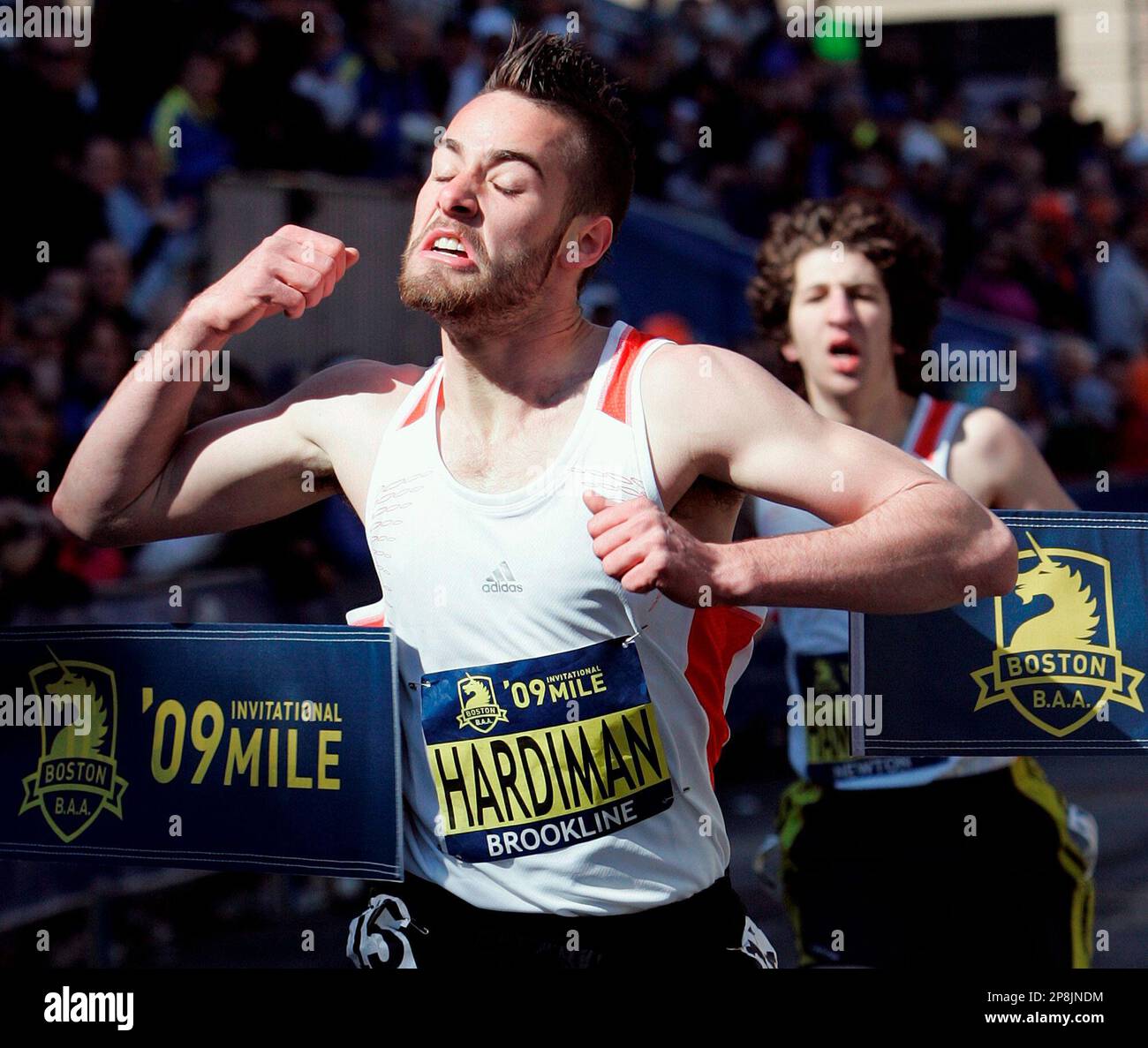 Ryan Hardiman, left, of Brookline, Mass., finishes first ahead of ...