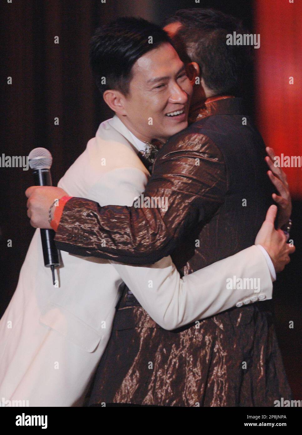 Hong Kong actor Nick Cheung Ka Fai, left, celebrates actor Eric Tsang ...