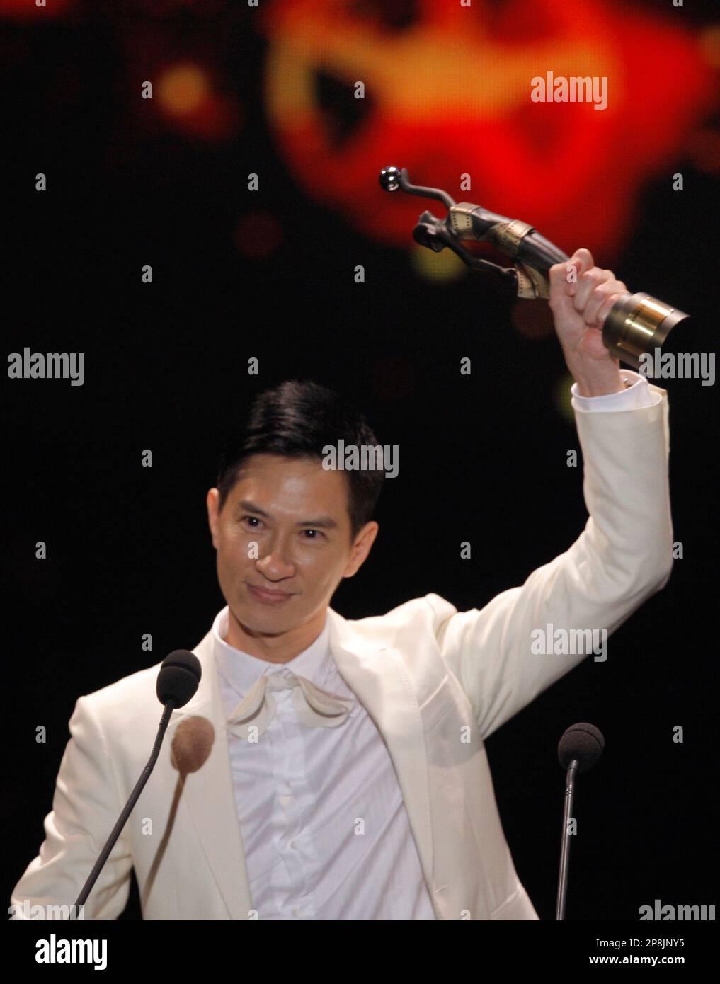 Hong Kong actor Nick Cheung Ka Fai celebrates with the trophy after ...