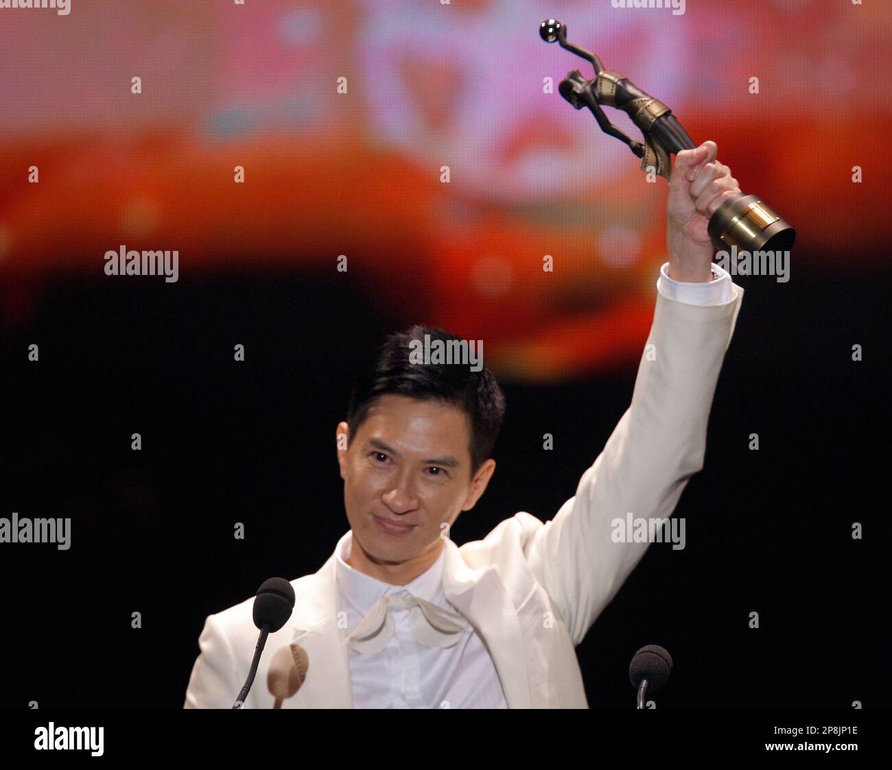 Hong Kong actor Nick Cheung Ka Fai celebrates with the trophy after ...