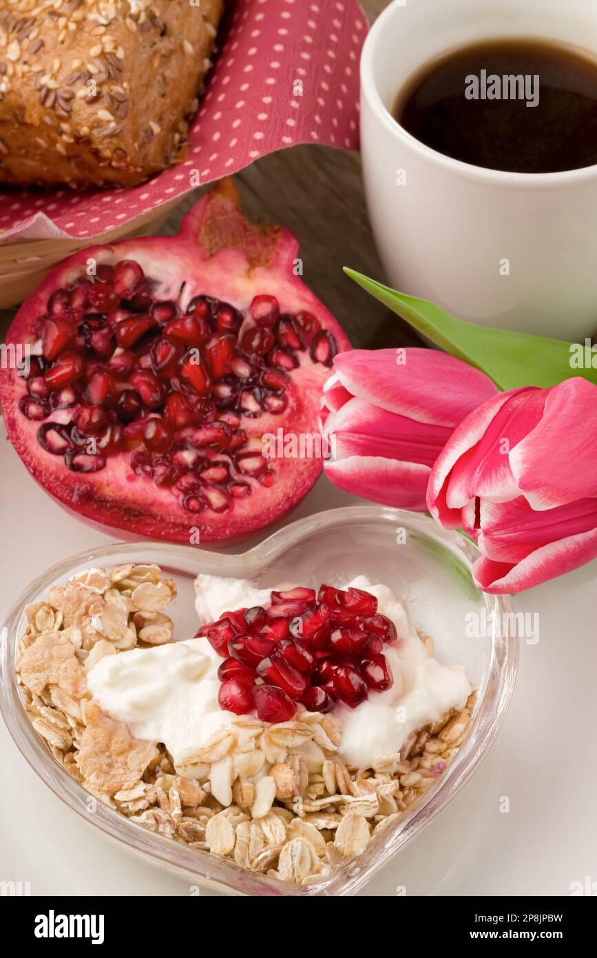 Healthy breakfast decorated with spring flowers Stock Photo - Alamy