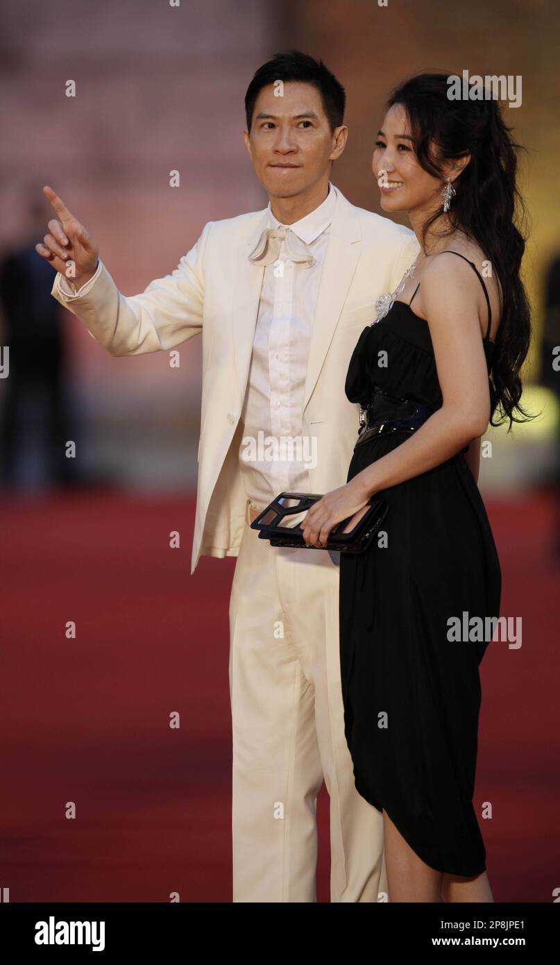 Hong Kong's actor Nick Cheung Ka Fai with his wife Kwan Wing Ho arrive ...