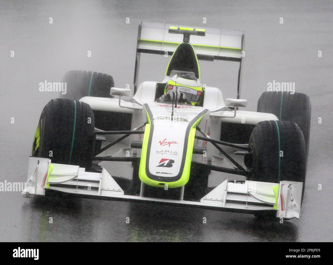 Brawn GP Formula One driver Rubens Barrichello of Brazil drives in rain ...