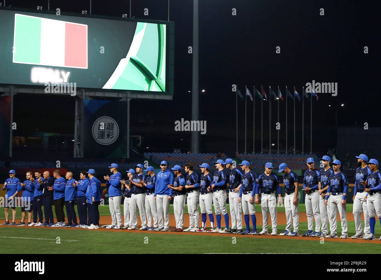 Italy's team members gather to sing the national anthem before the game ...