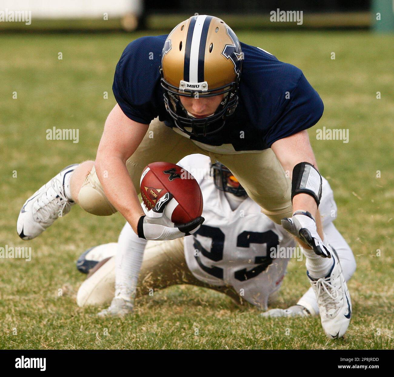 Montana State's Mark Desin dives past Jody Owens at the Triangle ...