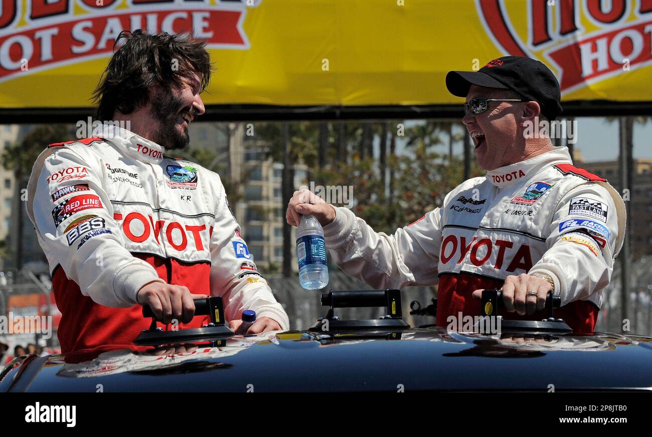 Celebrity driver Keanu Reeves, left, and professional driver Al Unser ...