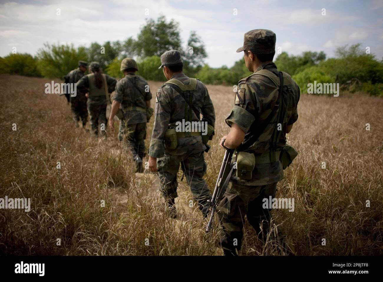 FILE - In this March 19, 2009 file photo, Mexican soldiers patrol near ...