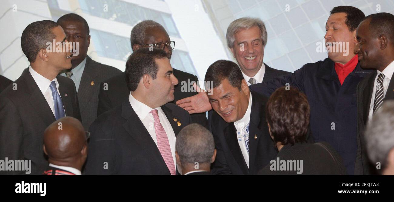 Venezuelan President Hugo Chavez, second from right, reaches out to ...