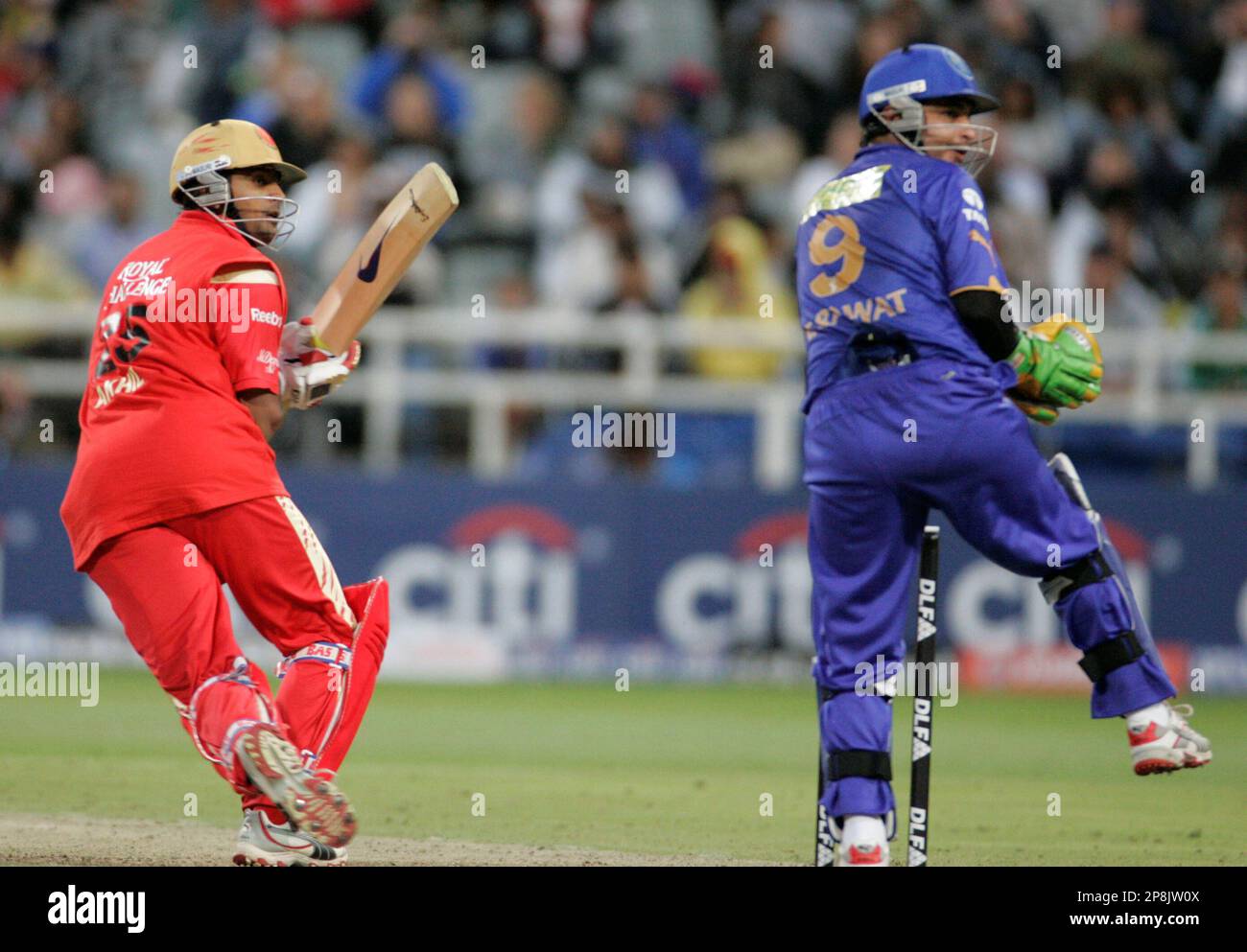 Bangalore Royal Challengers Balachandra Akhil, left, hits the ball ...