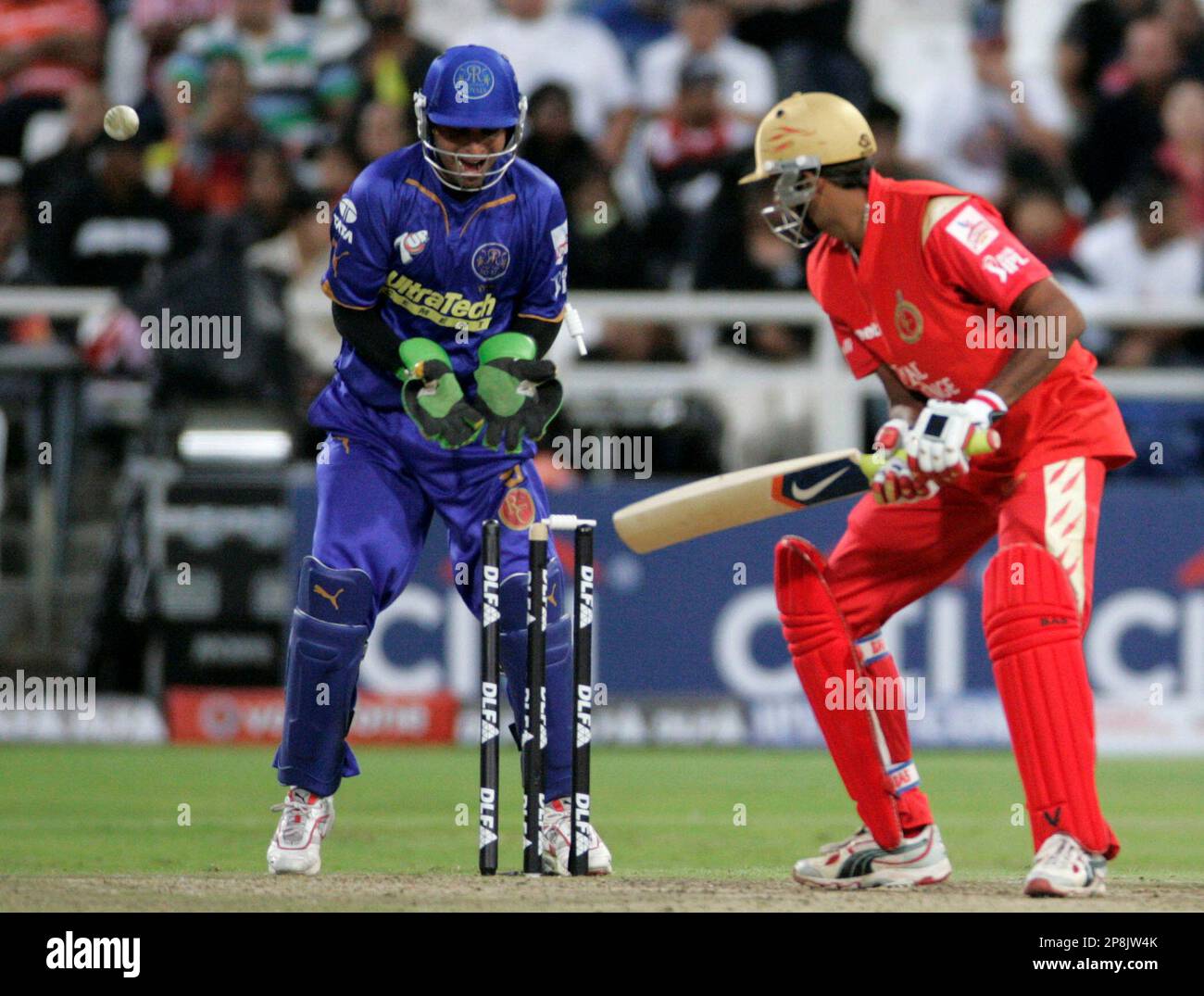Bangalore Royal Challengers' Balachandra Akhil, right, is bowled out by ...