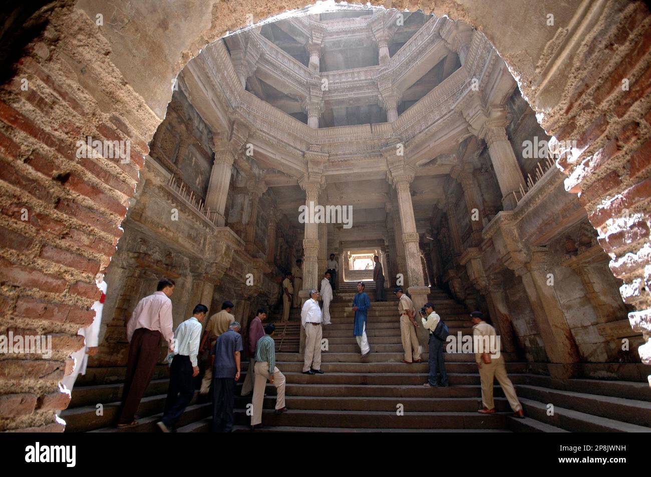 Visitors look on at the A.D. 1498 built step-well at Adalaj, about 20 ...