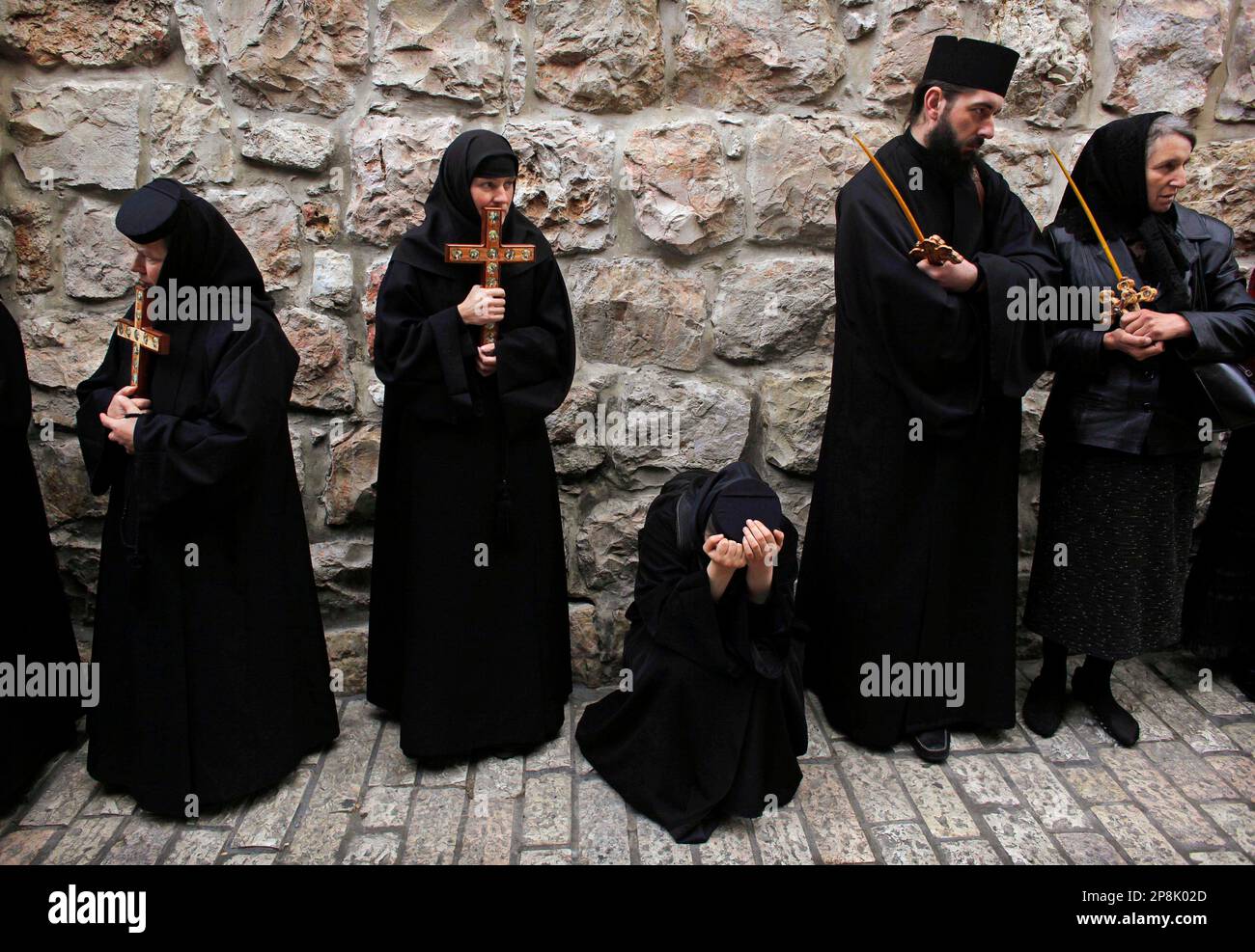 Christian Orthodox clergy wait for the beginning of the Good Friday ...