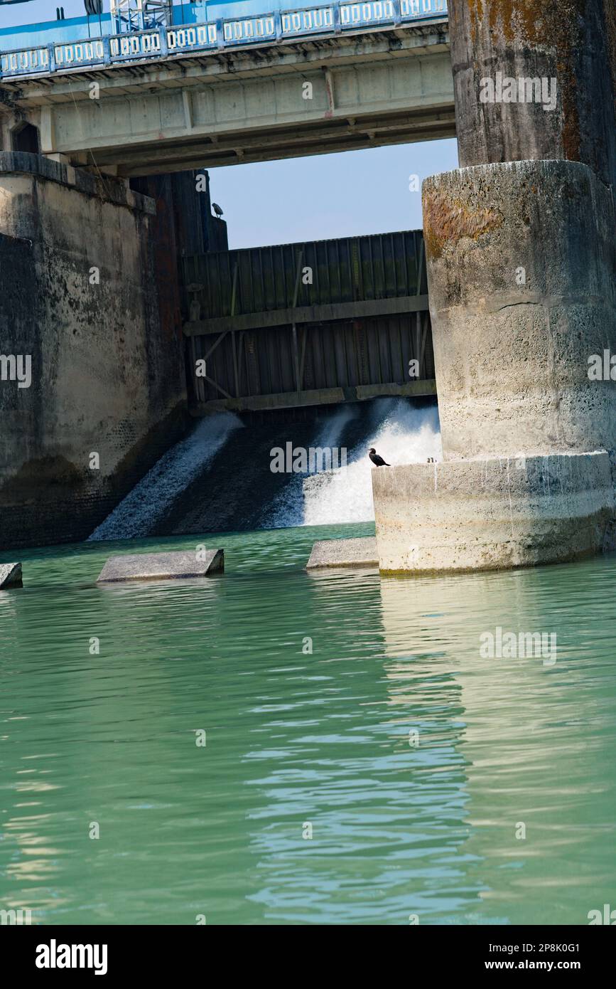 side view of river dam with road on top of the dam Stock Photo - Alamy