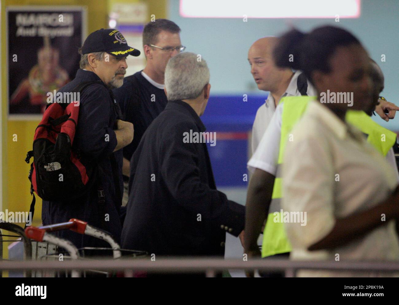 Richard Phillips, the captain of the Maersk Alabama, left , is directed ...